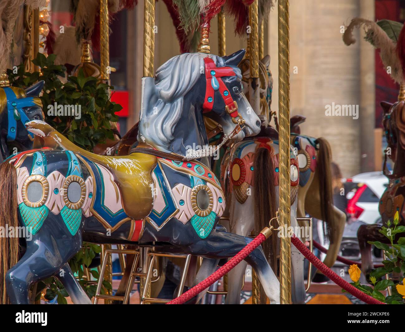A festive carousel horse in full color, adorned with Christmas ...