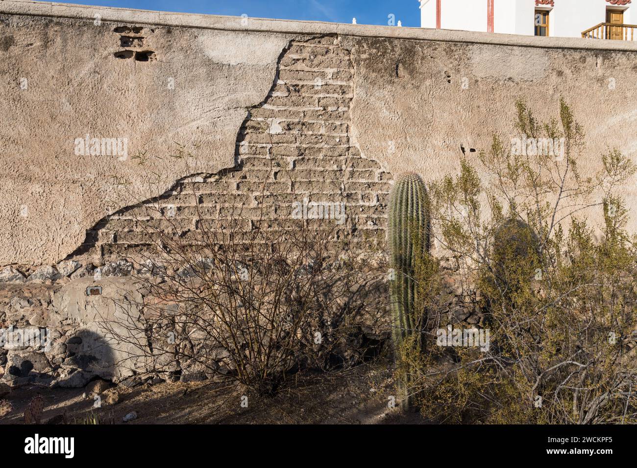 Detail of the adobe brick wall surrounding the Mission San Xavier del ...