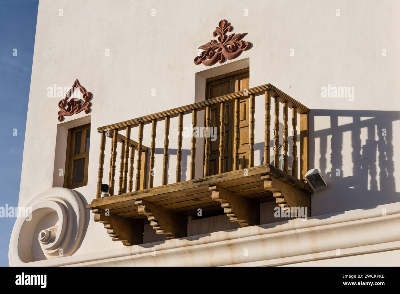 Detail of a wooden balcony and decorative designs on the Mission San ...