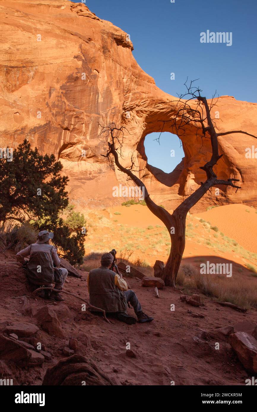 Photographers photograph the Ear of the Wind Arch in the Monument ...