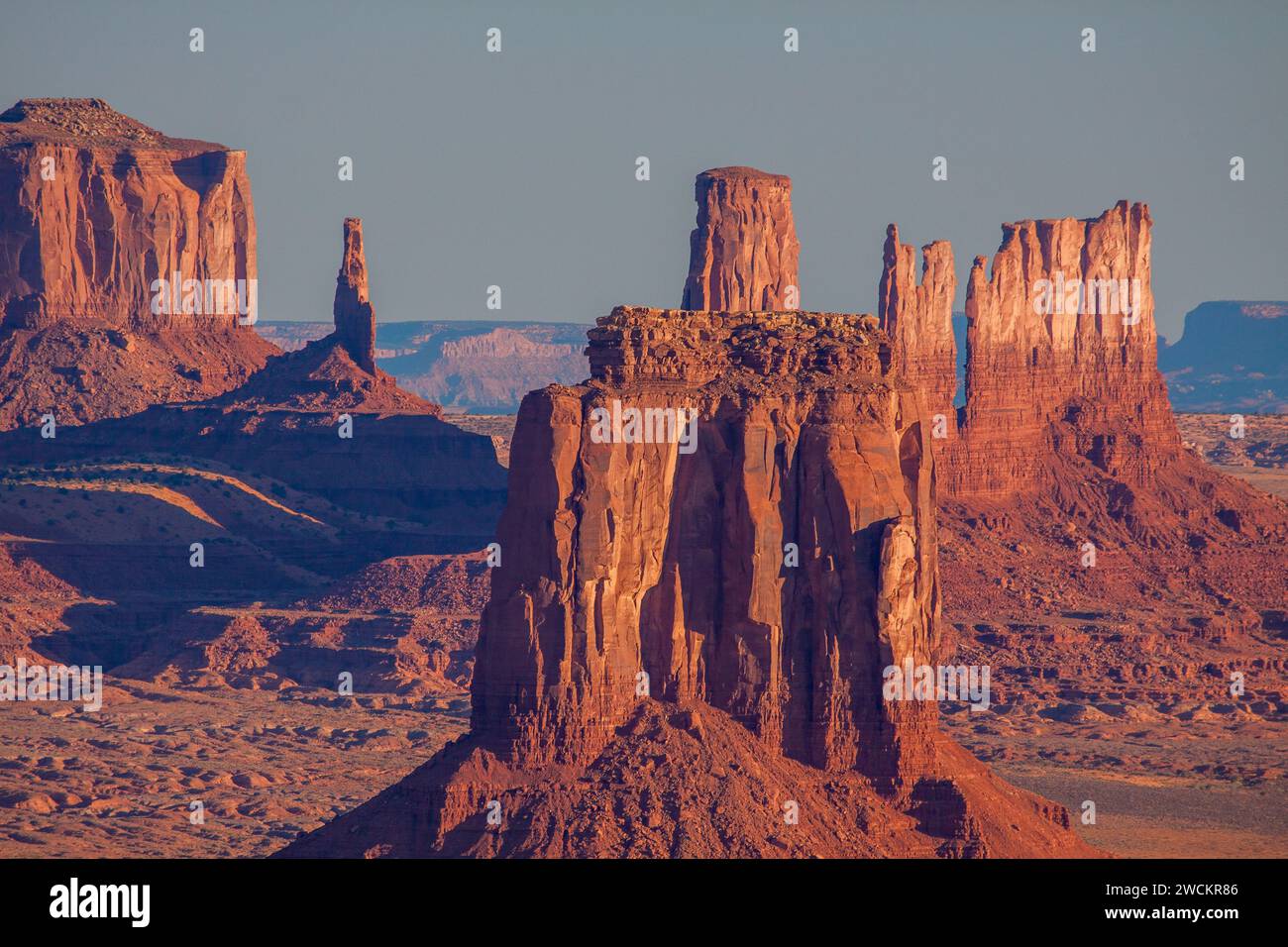 Telephoto view of the East Mitten & Utah monuments in Monument Valley ...
