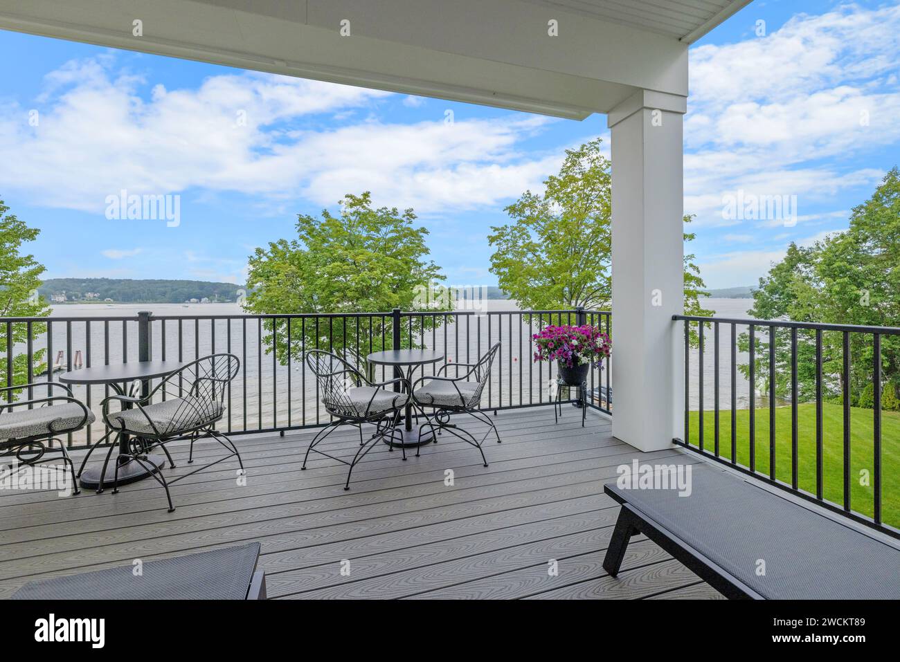 Outdoor patio with comfortable seating arrangements including a couch ...