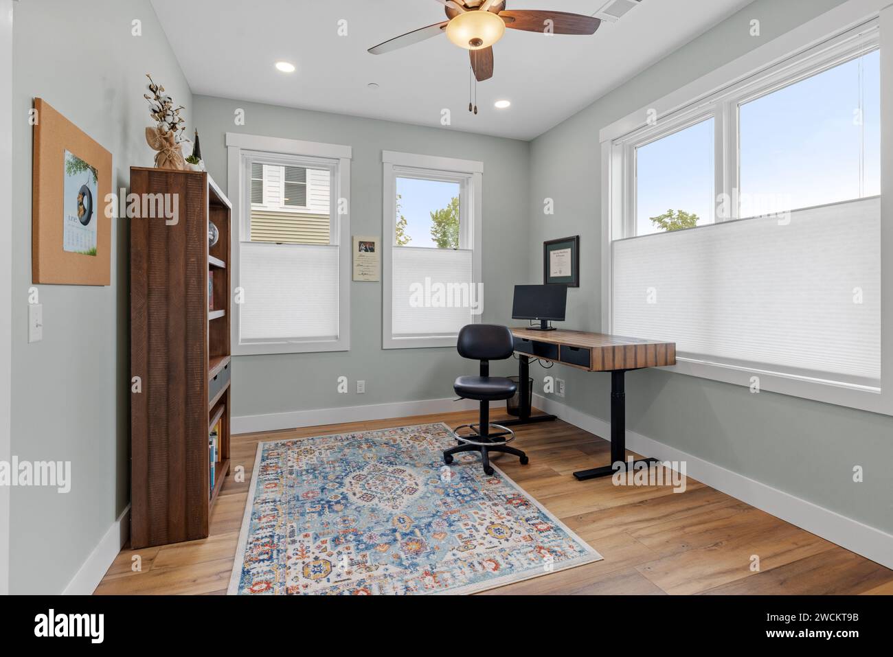 Ceiling fan in office corner, unoccupied window Stock Photo - Alamy