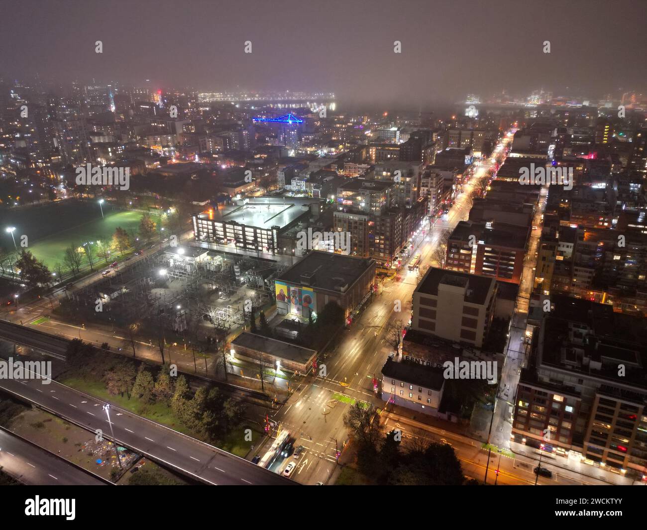 Aerial night view of traffic and buildings in the distance Stock Photo ...