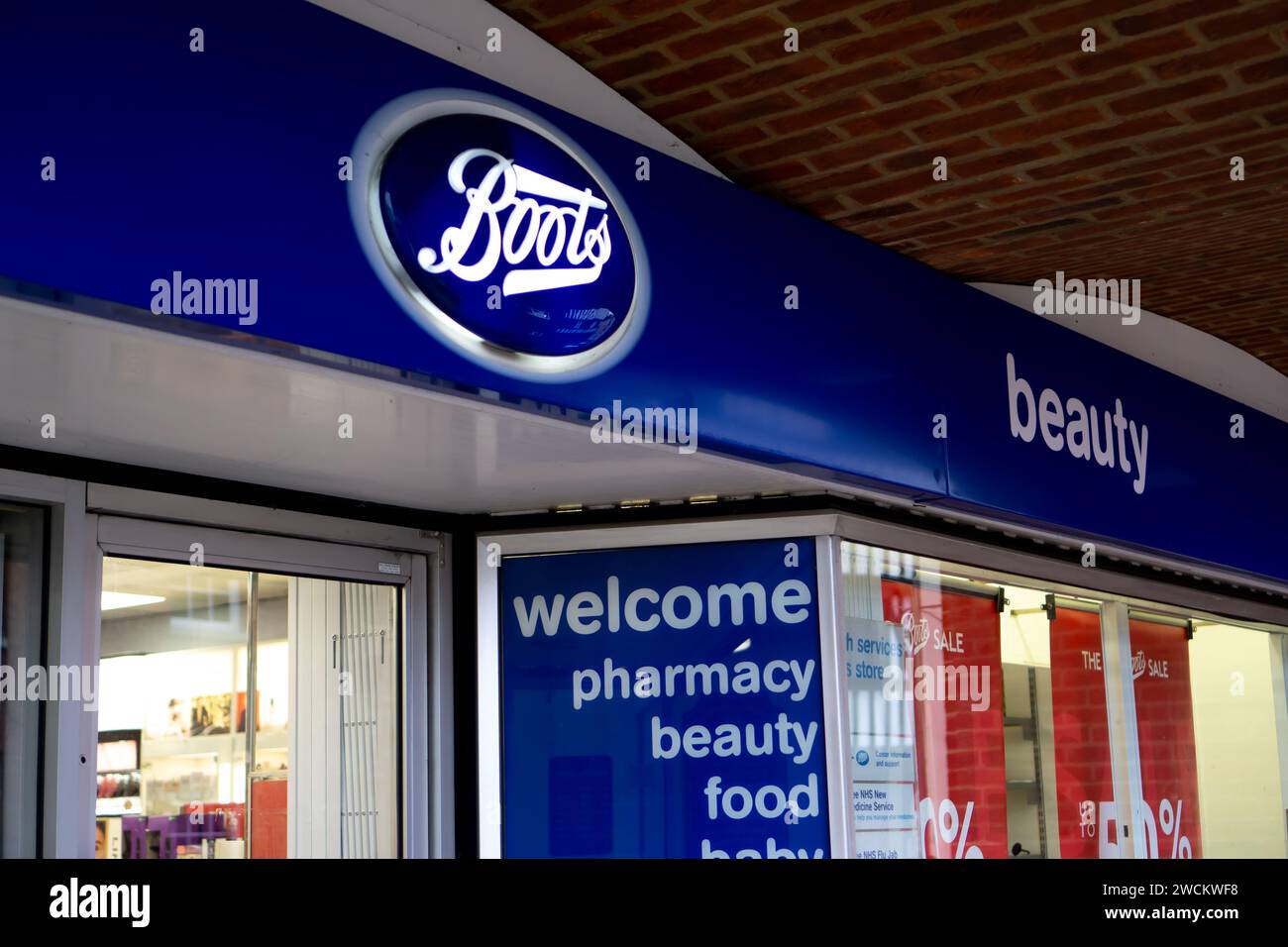 Boots the chemist overhead shop front sign Stock Photo - Alamy
