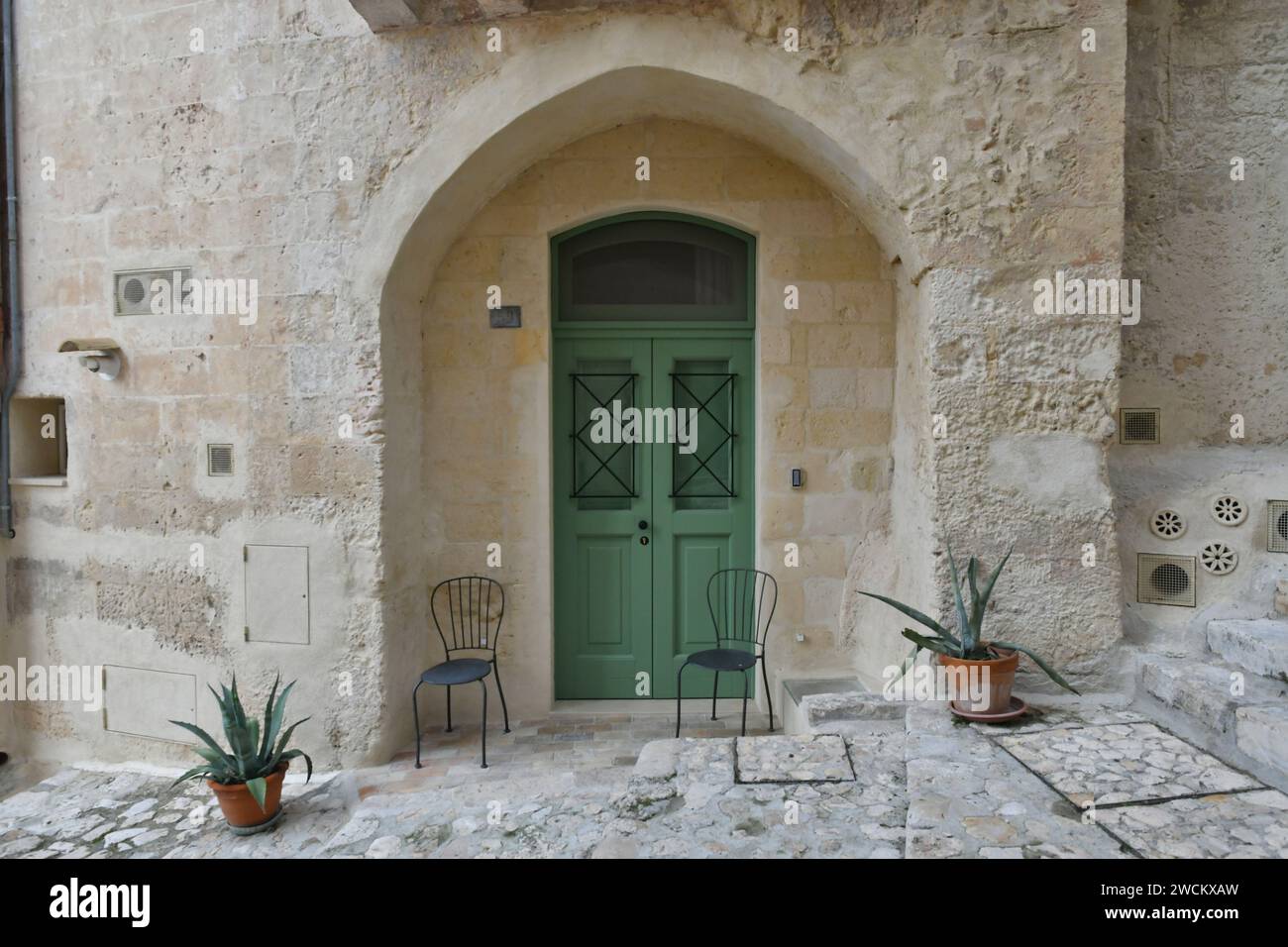Facade of an old house in Matera, an ancient city in Basilicata, Italy ...