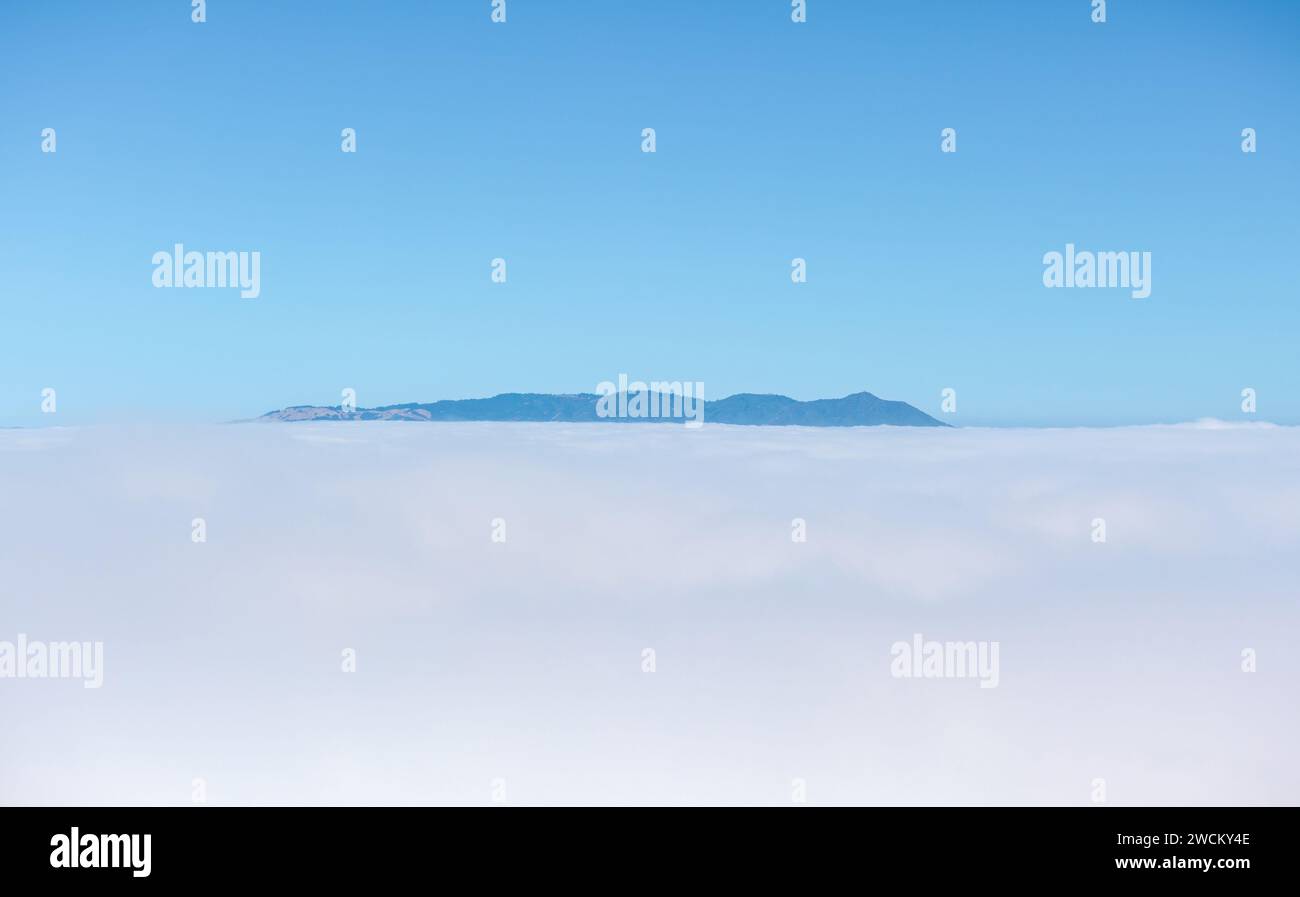 San Francisco hills over the clouds Stock Photo - Alamy