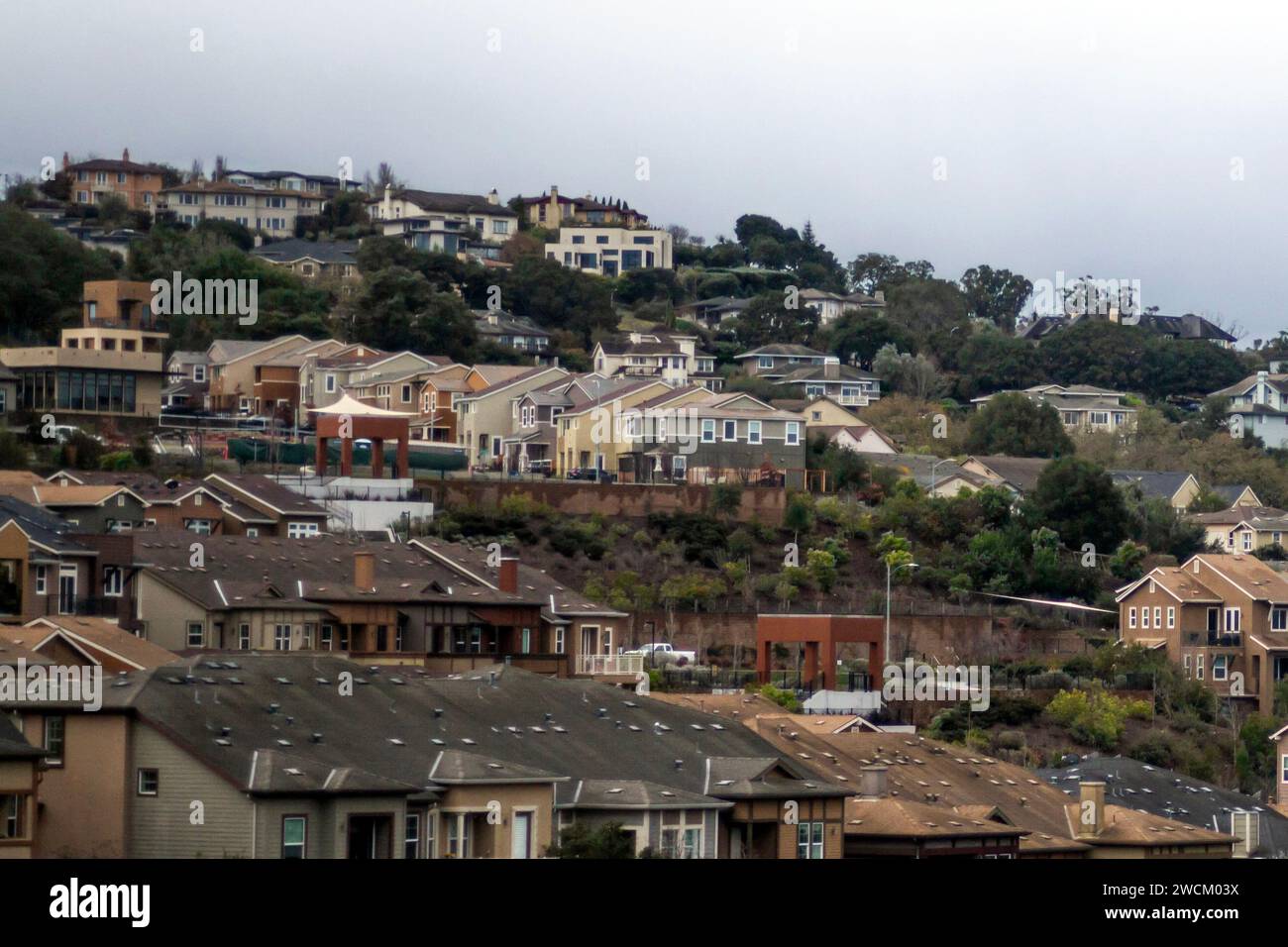 Brown houses on a hillside, neighborhood in various shades of tan and ...
