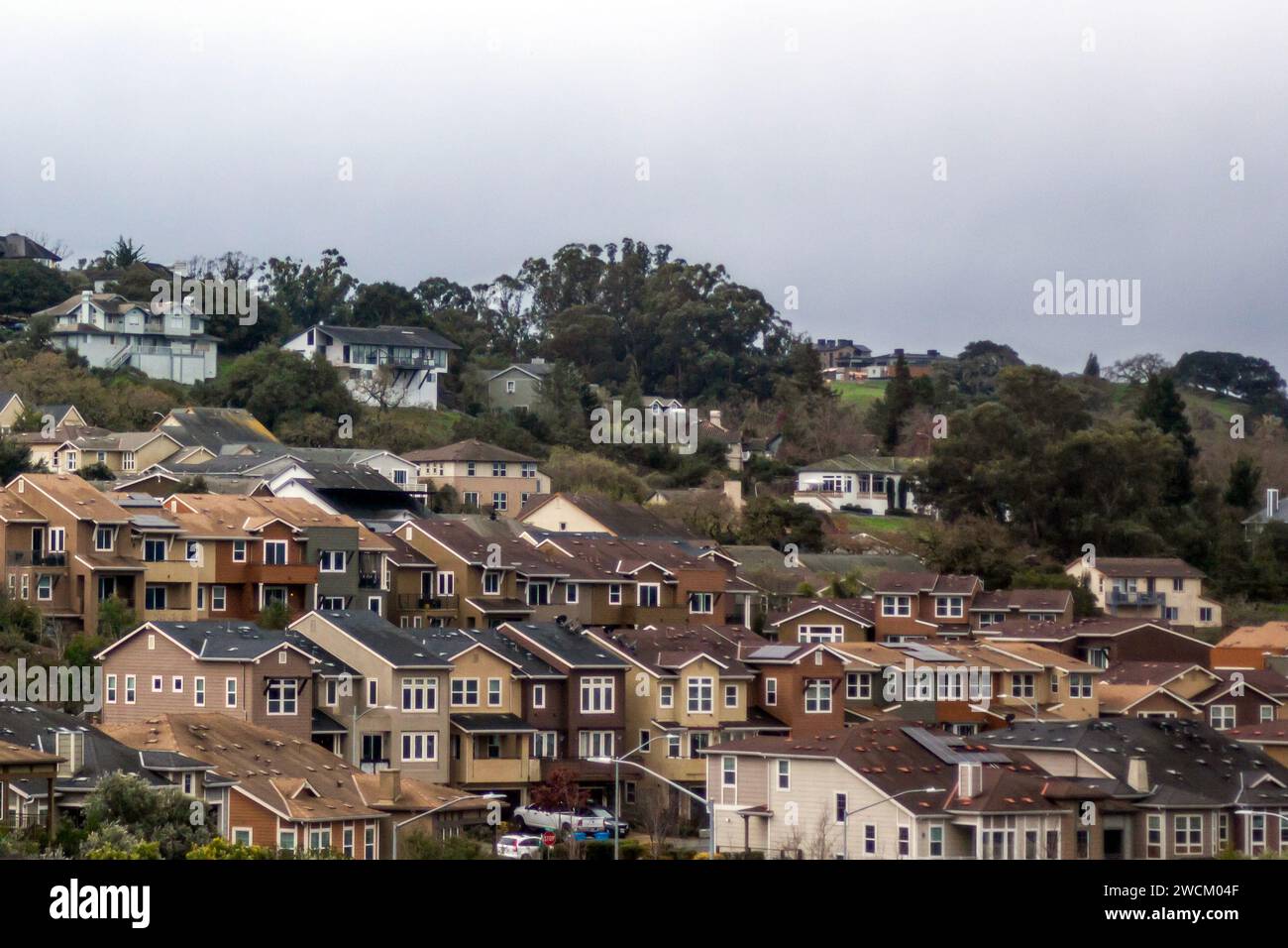 Brown houses on a hillside, neighborhood in various shades of tan and ...