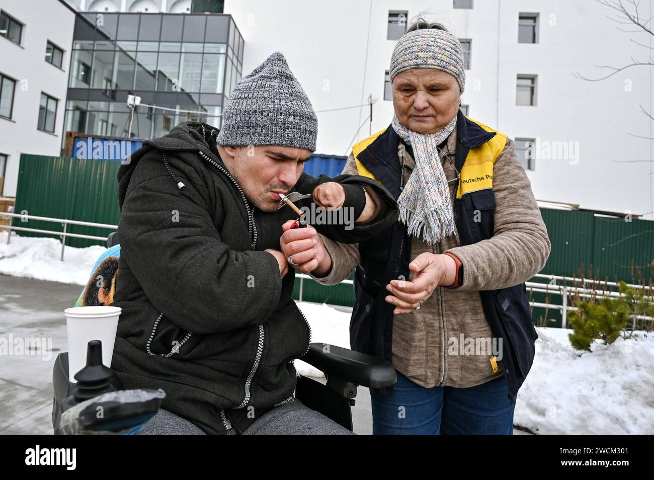 LVIV, UKRAINE - JANUARY 15, 2024 - Mother Tetiana lights a cigarette for her son, soldier ...