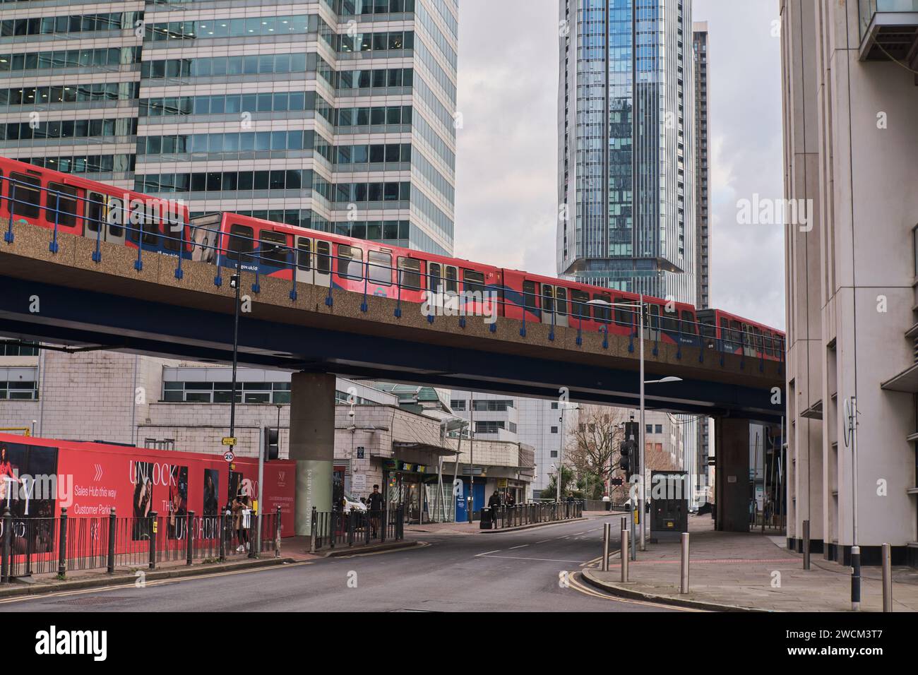 Docklands Light Railway (DLR) train, passing overhead, snaking through ...