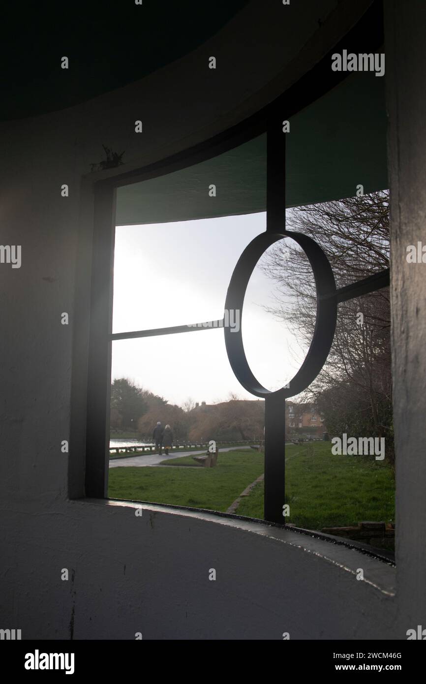 Looking out of the unglazed window of a charming 1930s art deco window ...