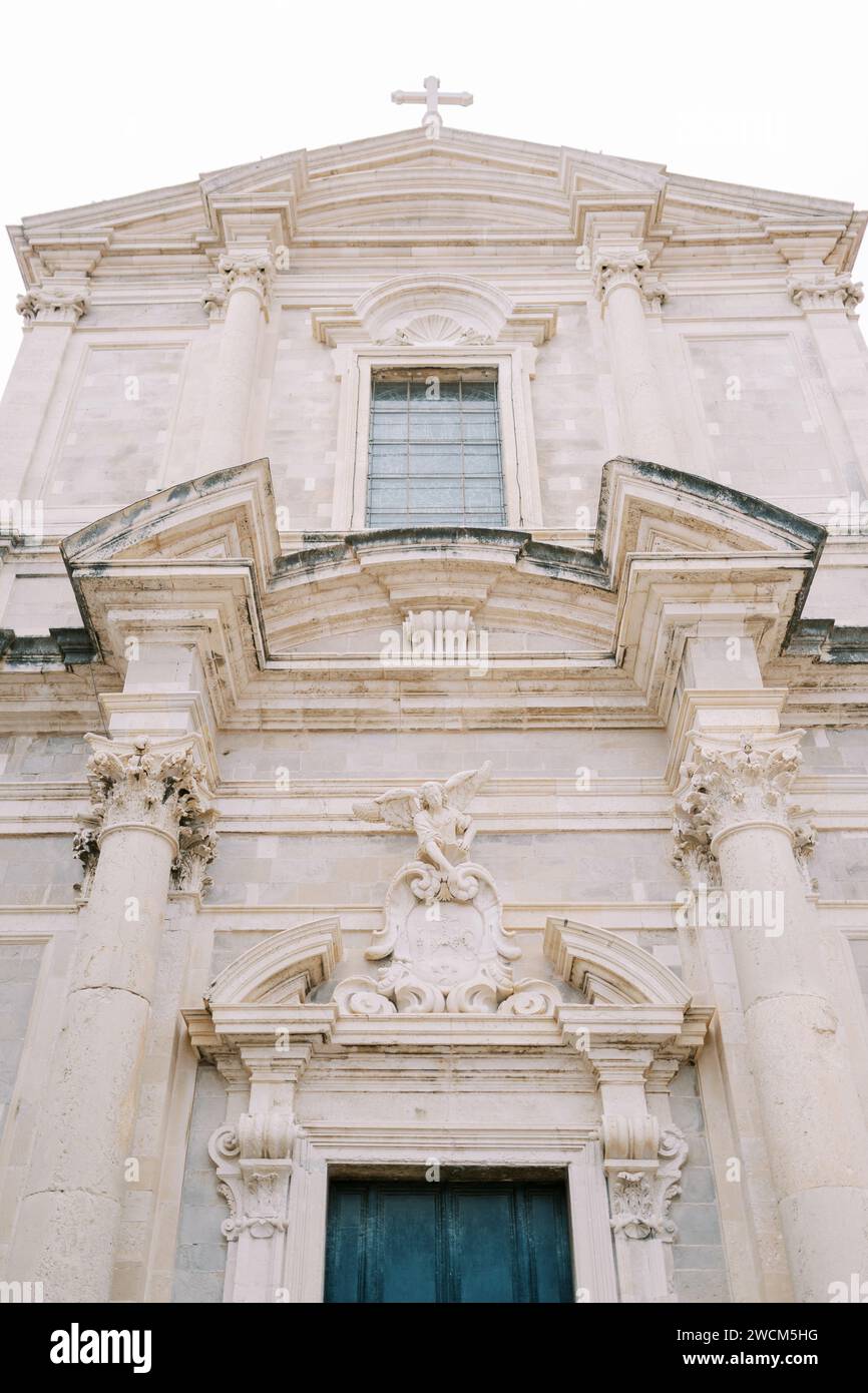 Marble facade with sculptures above the entrance of the Church of St ...