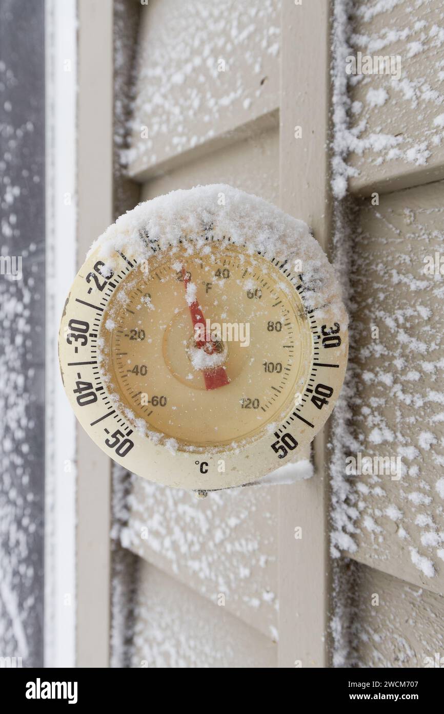 Snow Capped Thermometer Mounted on Wooden Siding of House Showing ...
