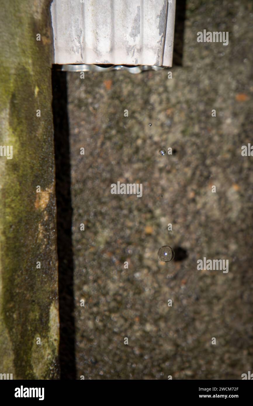 Water Droplets Dripping from Storm Drain Stock Photo - Alamy