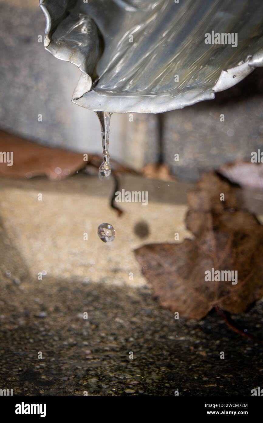 Water Droplets Dripping from Storm Drain Stock Photo - Alamy