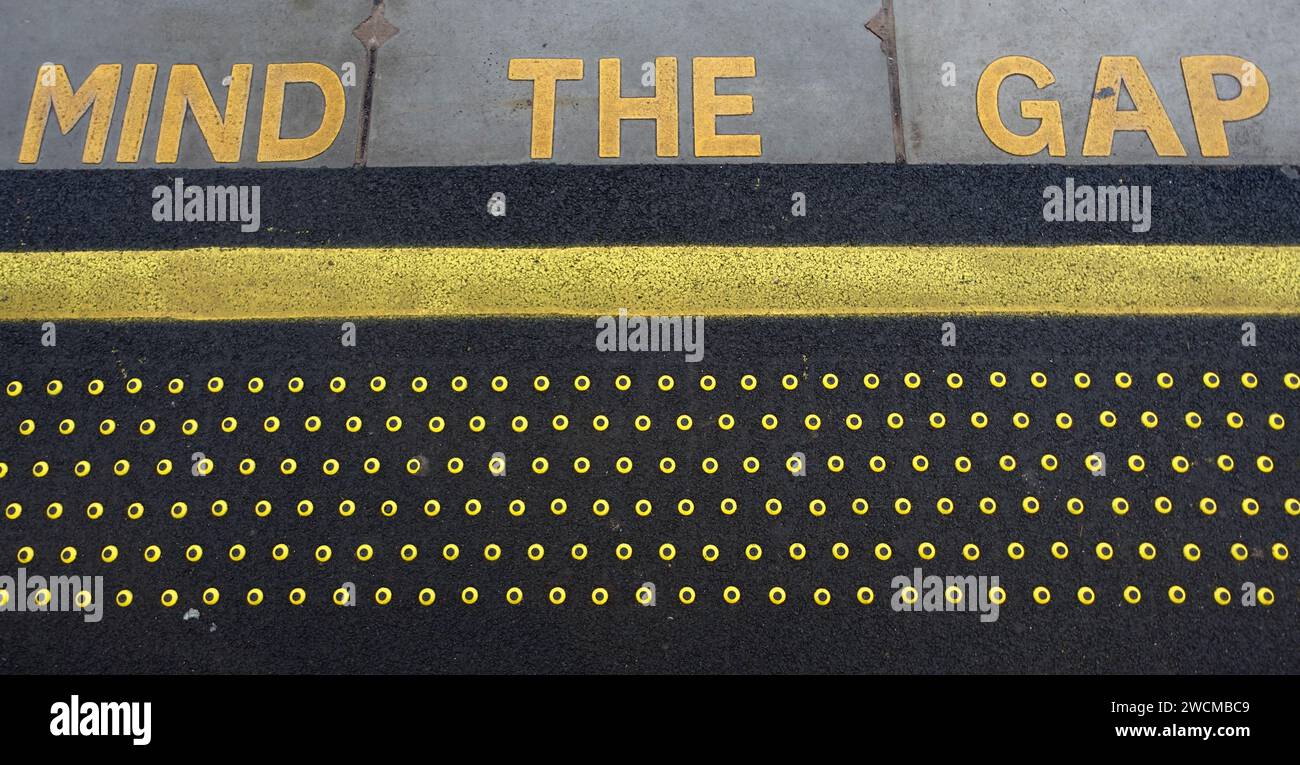 Mind the Gap sign on train station platform, UK Stock Photo - Alamy