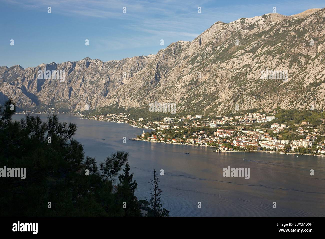 The quaint village of Kotor in Montenegro nestles along the serene bay ...