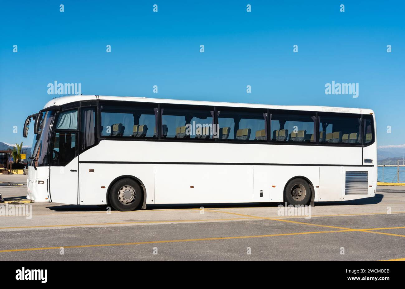 White empty bus at the bus station parking lot. Coach Bus. White ...