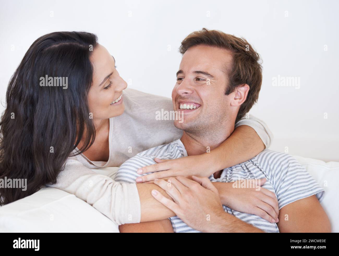 Happy people, couple hug and love with trust, marriage and relax on ...