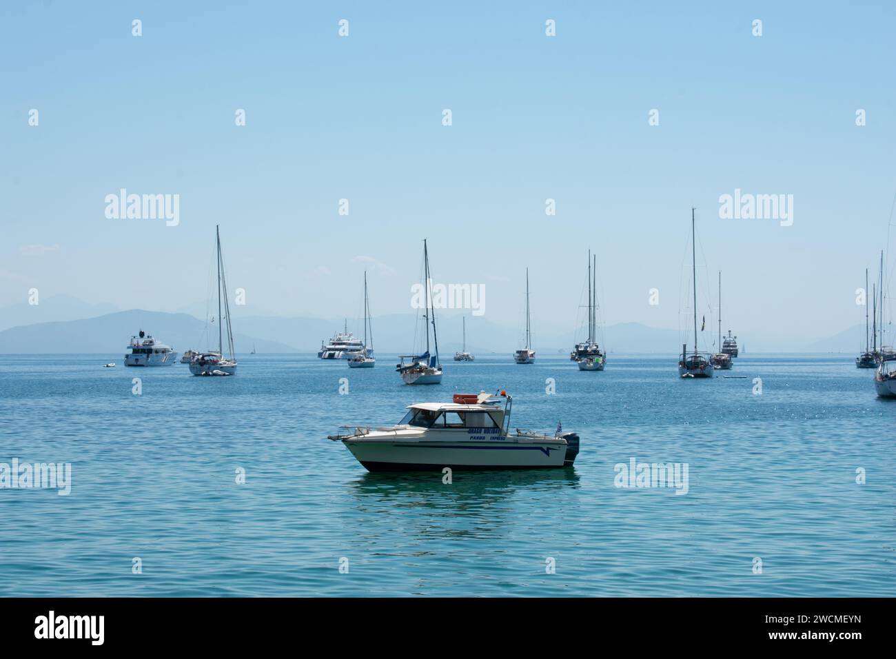 Boats in the beach corfu isle Stock Photo - Alamy