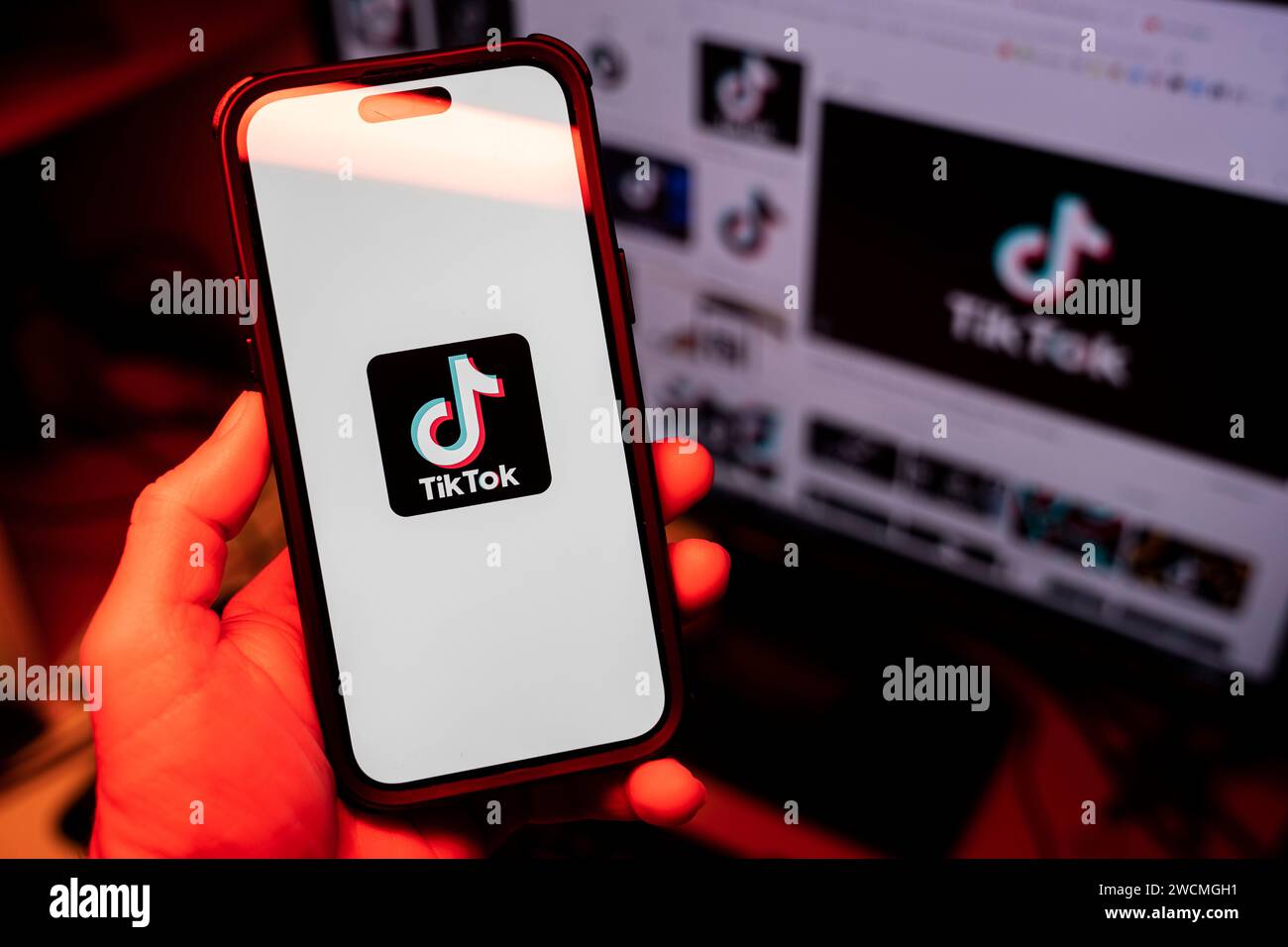 Hand holding a Apple iPhone 14 Pro Max smartphone with TIK TOK logo, it ...