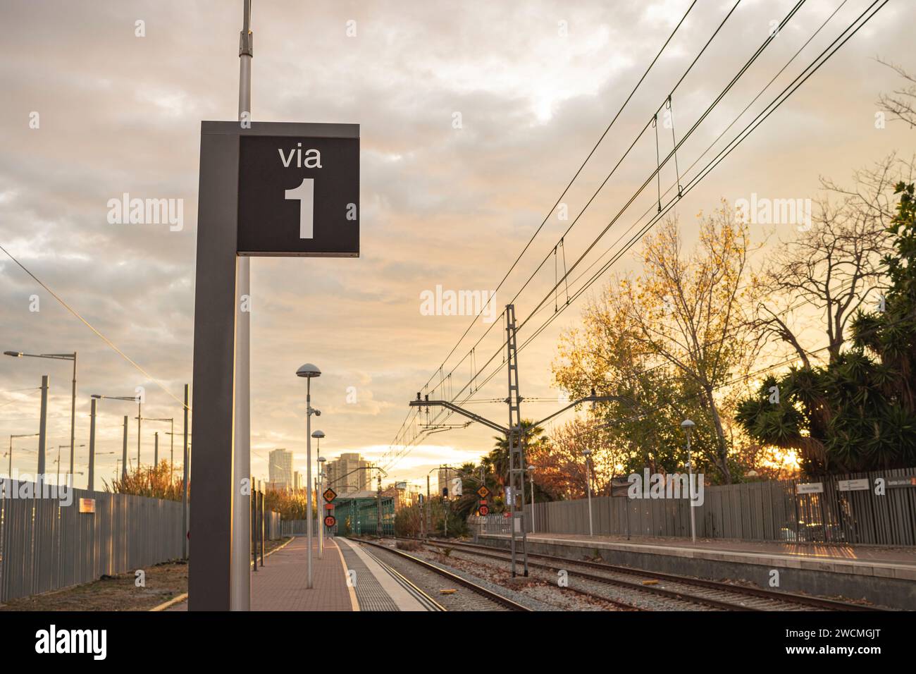 Outdoor platform with an approaching train Stock Photo - Alamy