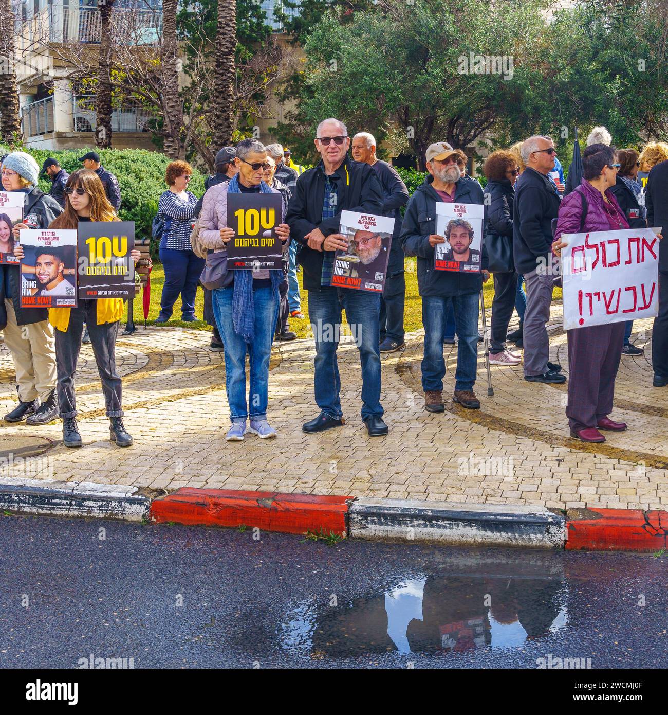 Haifa, Israel - January 14, 2024: People with various signs and flags ...