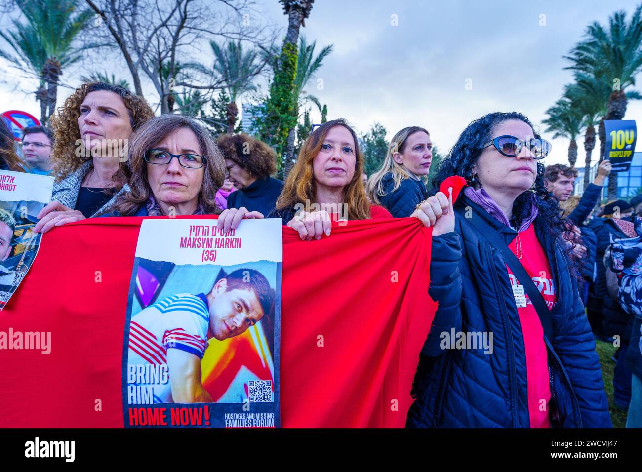 Haifa, Israel - January 14, 2024: People with various signs and flags ...