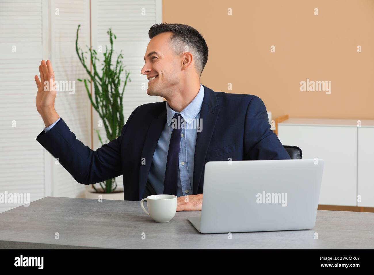 Office people saying hi hi-res stock photography and images - Alamy