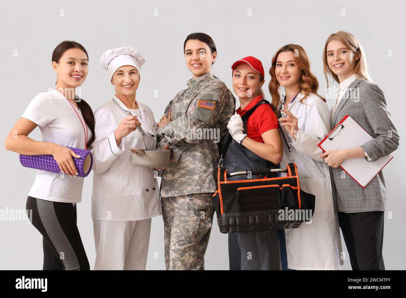 Women of different professions on grey background Stock Photo - Alamy