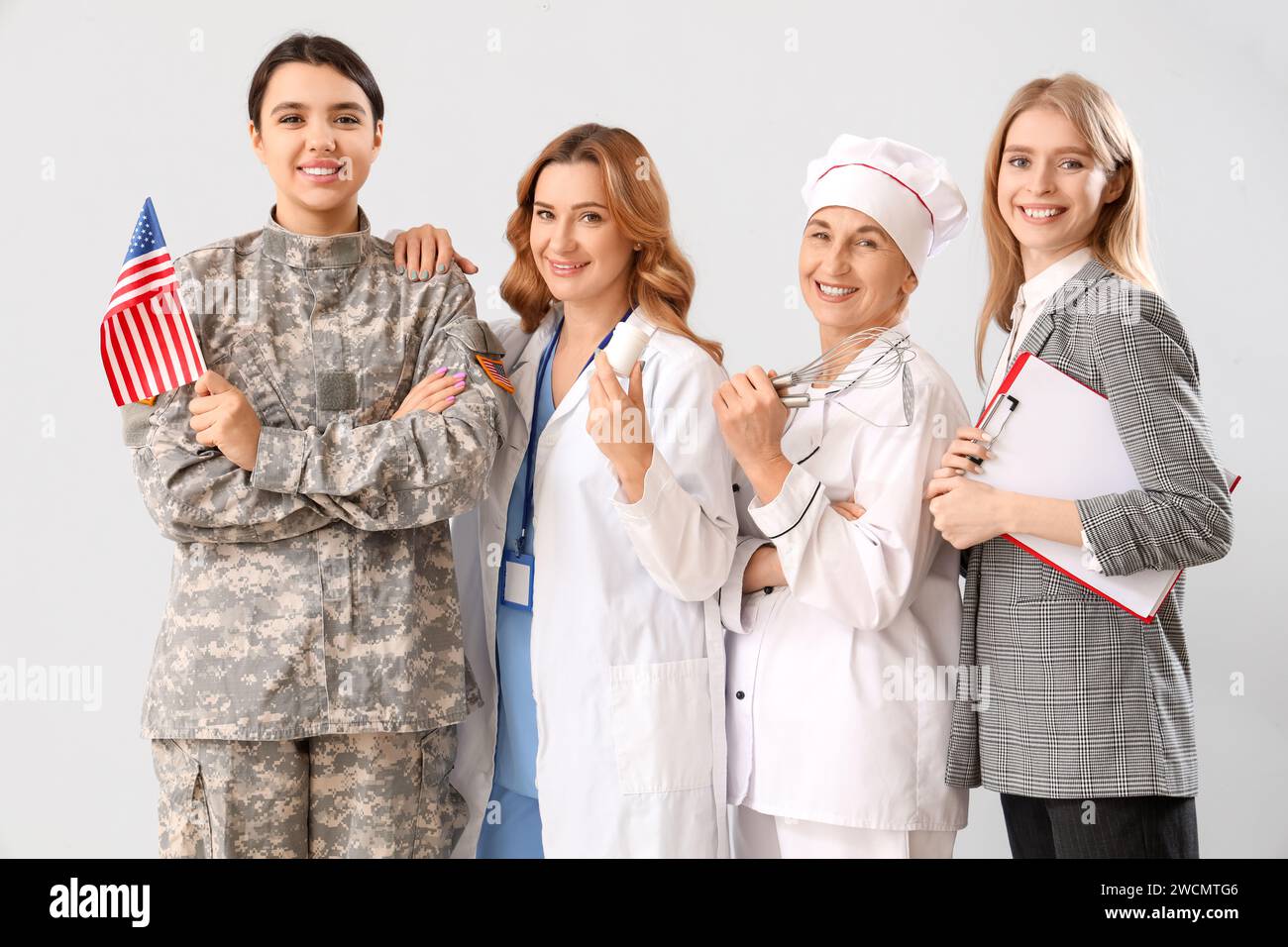Women of different professions on grey background Stock Photo - Alamy