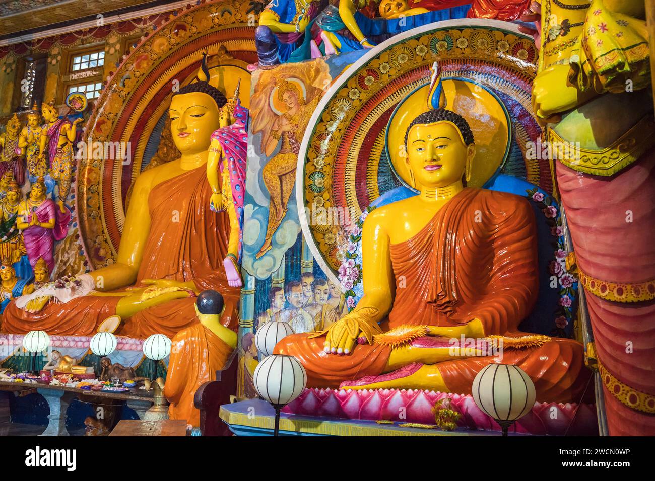 Buddha statues and colorful decoration of the Gangaramaya temple, one ...