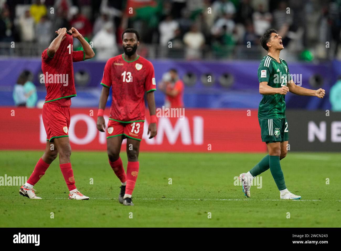 Saudi Arabia's Faisal Alghamdi, right, reacts after the Asian Cup Group F soccer match between ...