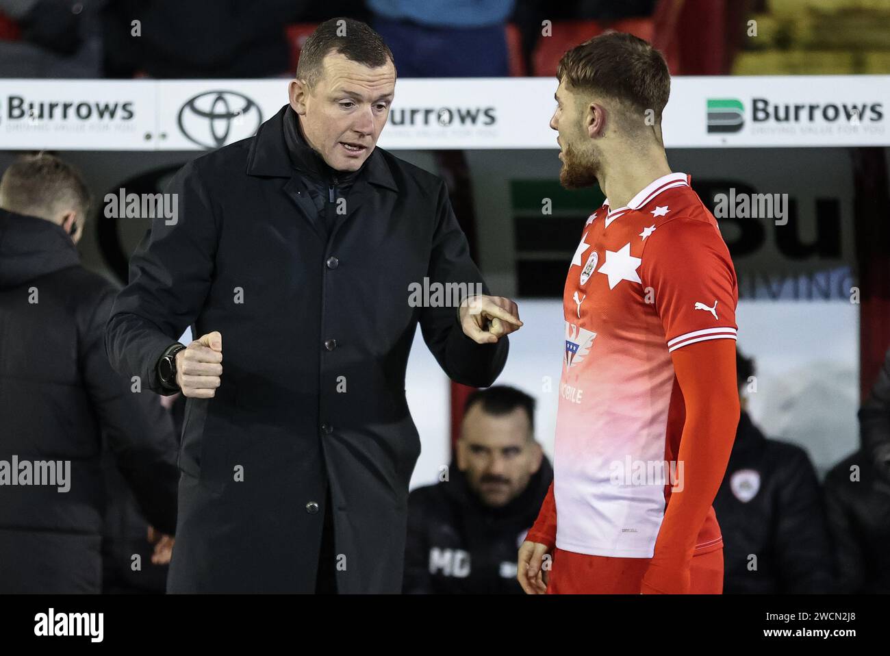 Neill Collins Head coach of Barnsley gives John Mcatee of Barnsley ...
