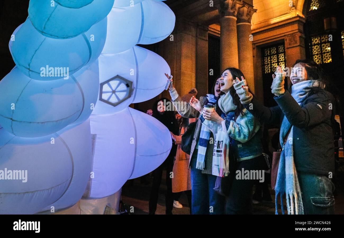 London, UK. 16th Jan, 2024. Visitors have fun with an installation ...