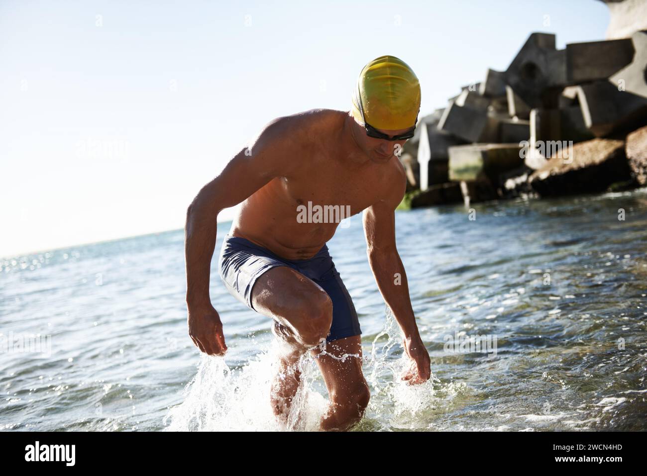 Beach sports, fitness and man for swimming training, workout or ...