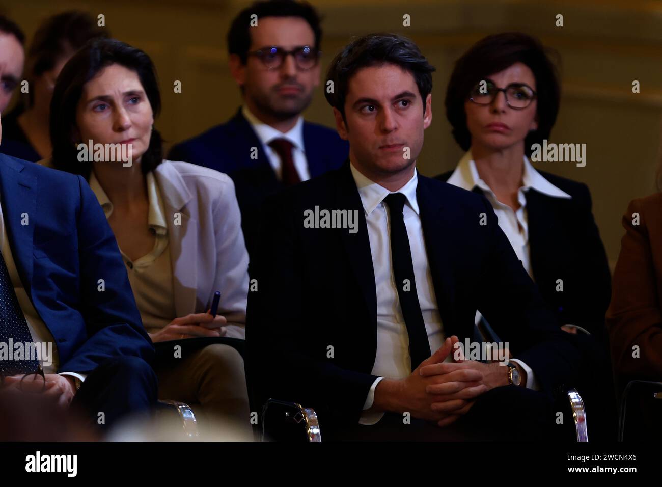 French Prime Minister Gabriel Attal, center right, listens to French ...