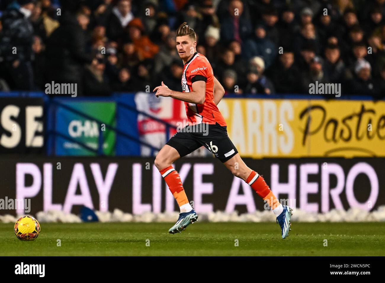 Reece Burke of Luton Town makes a break with the ball during the ...
