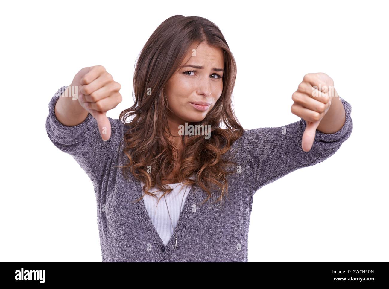 Thumbs down, portrait and unhappy woman in studio with rating for ...