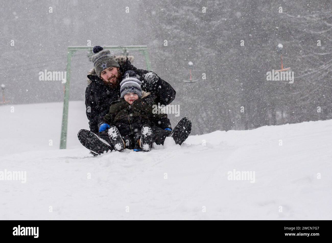Ashton Johnson, 4, and his father Justin, of Brattleboro, Vt., go ...