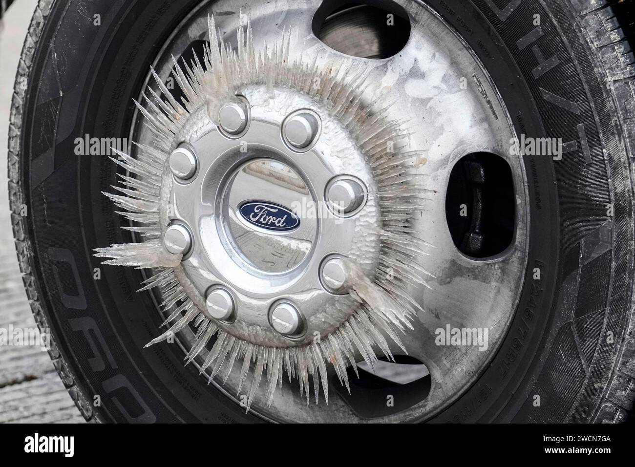 Ice forms on a truck's wheel as temperatures dropped below freezing ...