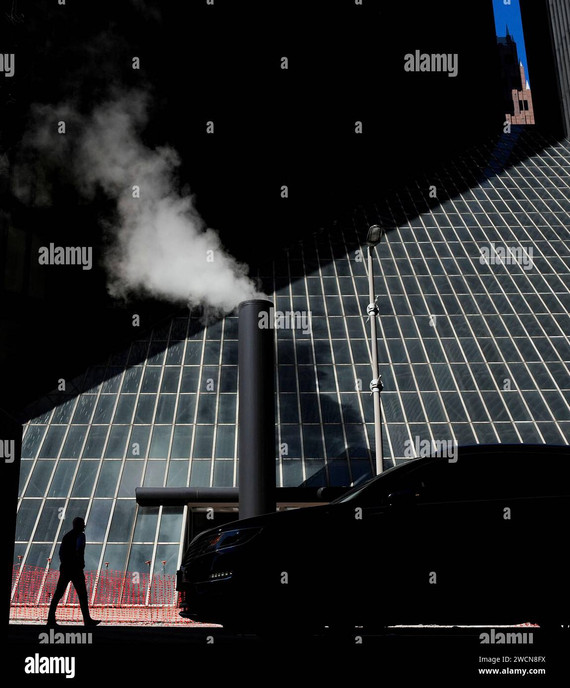 A pedestrian braves the cold as he walks to Pennzoil Place in downtown ...