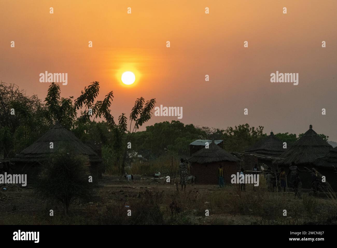 Uganda, Adjumani. South Sudan refugees in a refugee camps at sunset ...