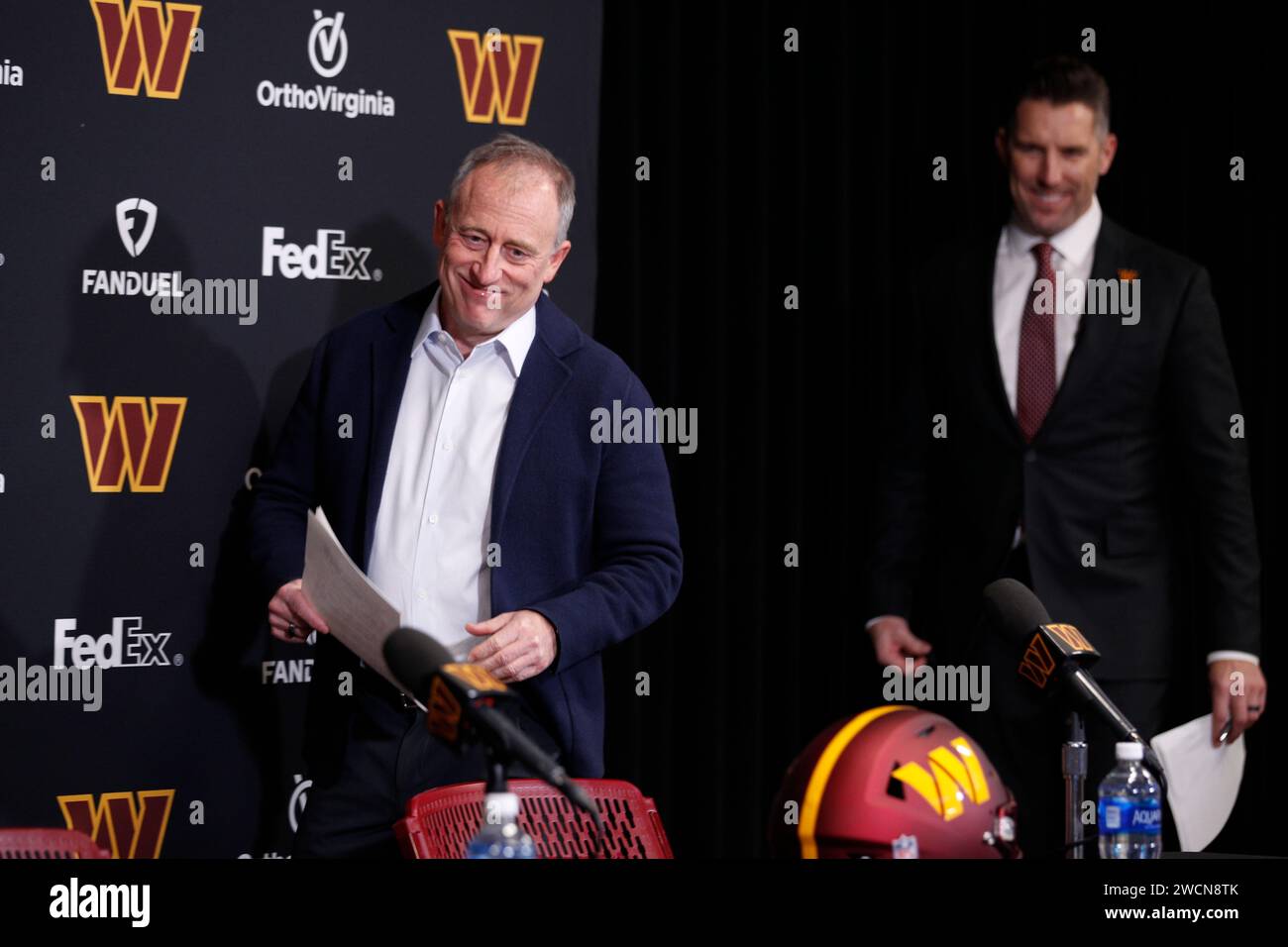 Washington Commanders owner Josh Harris, left, walks into a an NFL ...