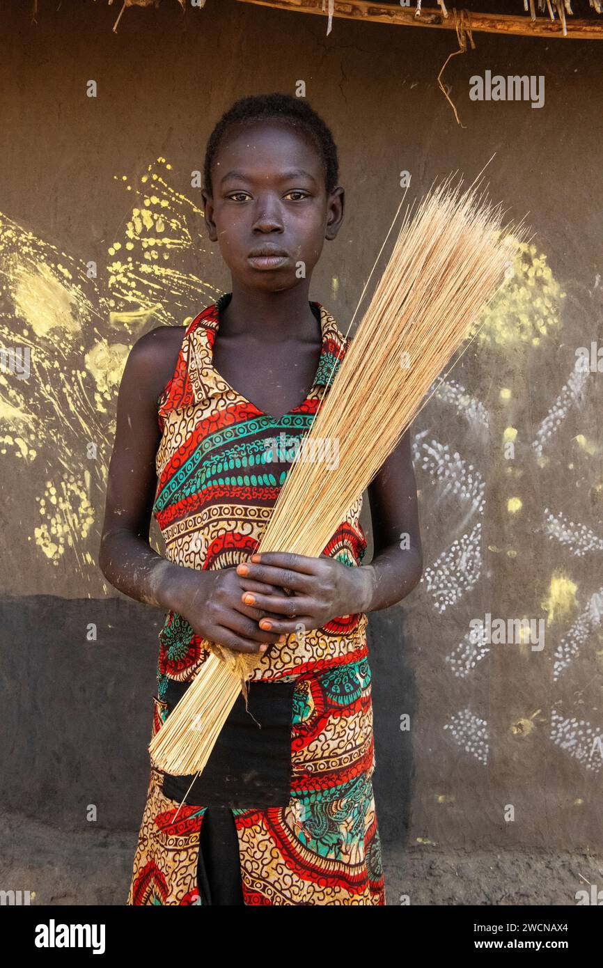 Uganda, Adjumani. Portrait of a child with her broom. Editorial use ...