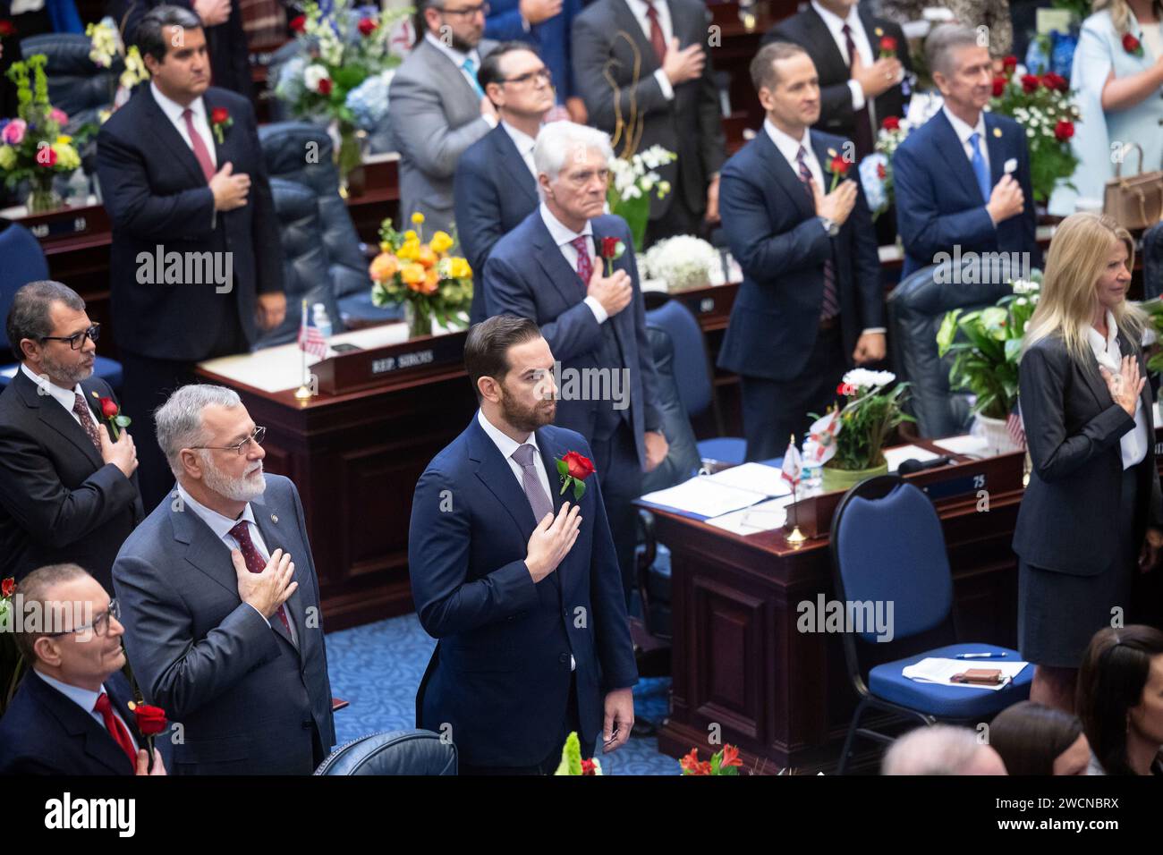 Florida State Rep. Daniel Perez, at bottom center, and other members of ...