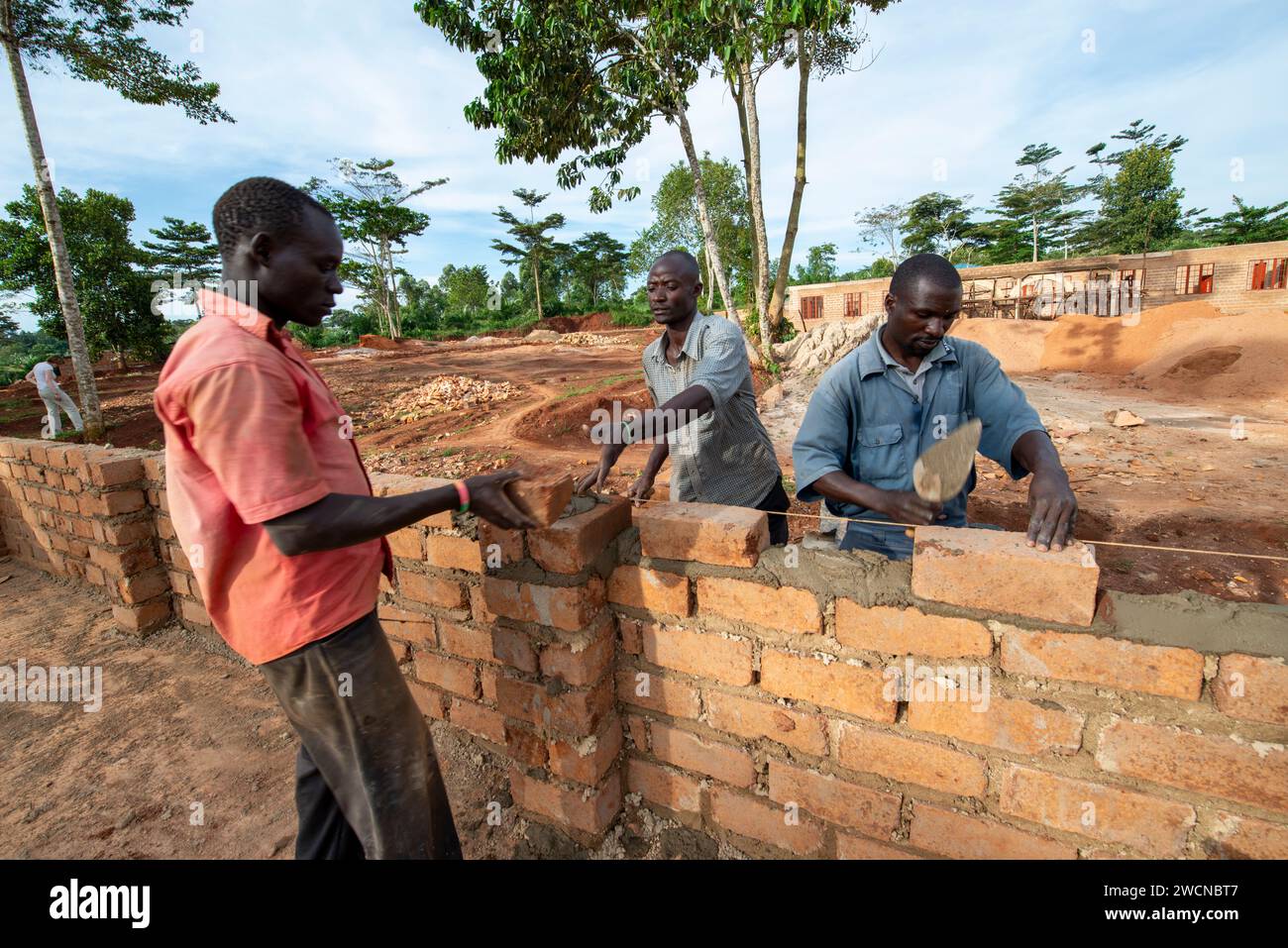 Uganda, Mukono District. A new school being built by handmade bricks ...