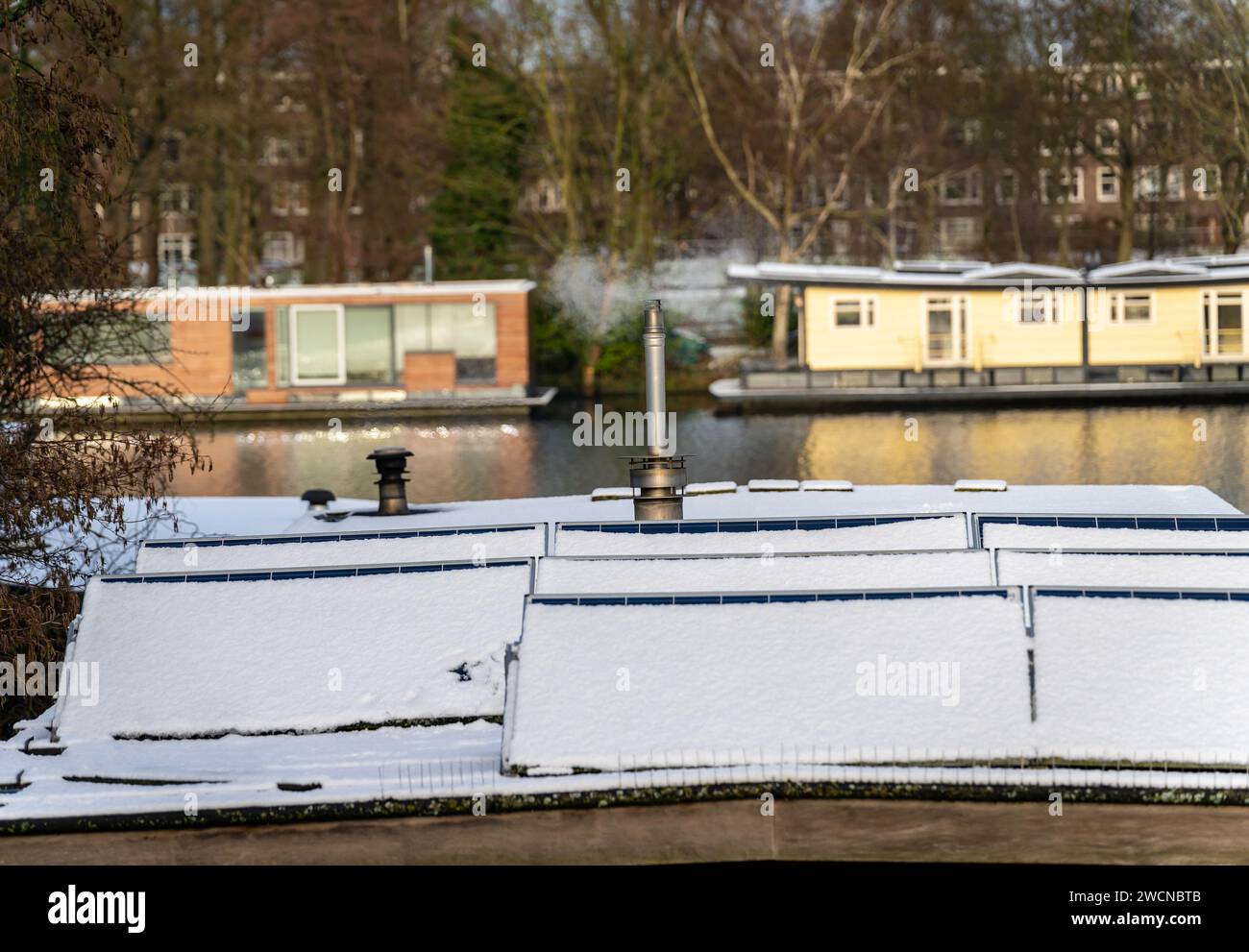 Solar panels on dutch houseboat covered with snow in the winter Stock ...