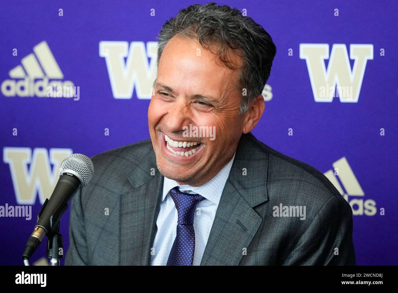 New Washington head coach Jedd Fisch laughs during an NCAA college ...
